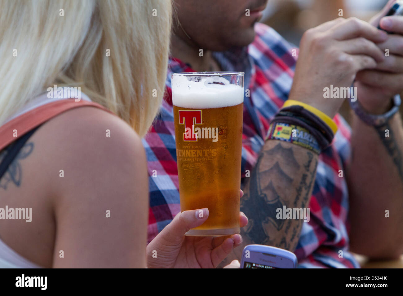 People drinking pints of larger beer Stock Photo - Alamy
