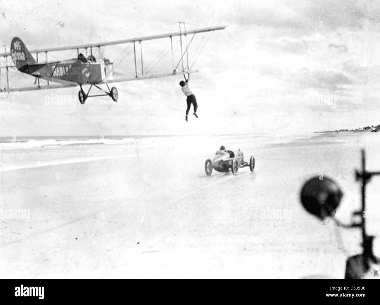 A daring auto-to-airplane transfer stunt is performed at Daytona Beach ...