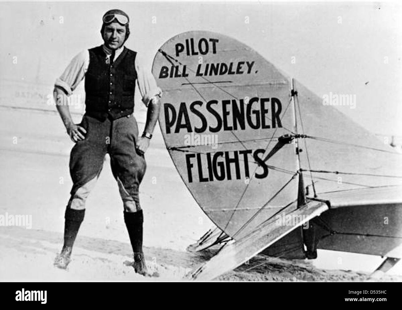 Pilot Bill Lindley stands next to his Curtiss JN-4 biplane, part of the ...