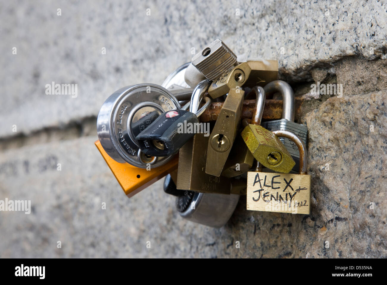Clusters of padlocks attached to the piers of the Brooklyn Bridge as ...