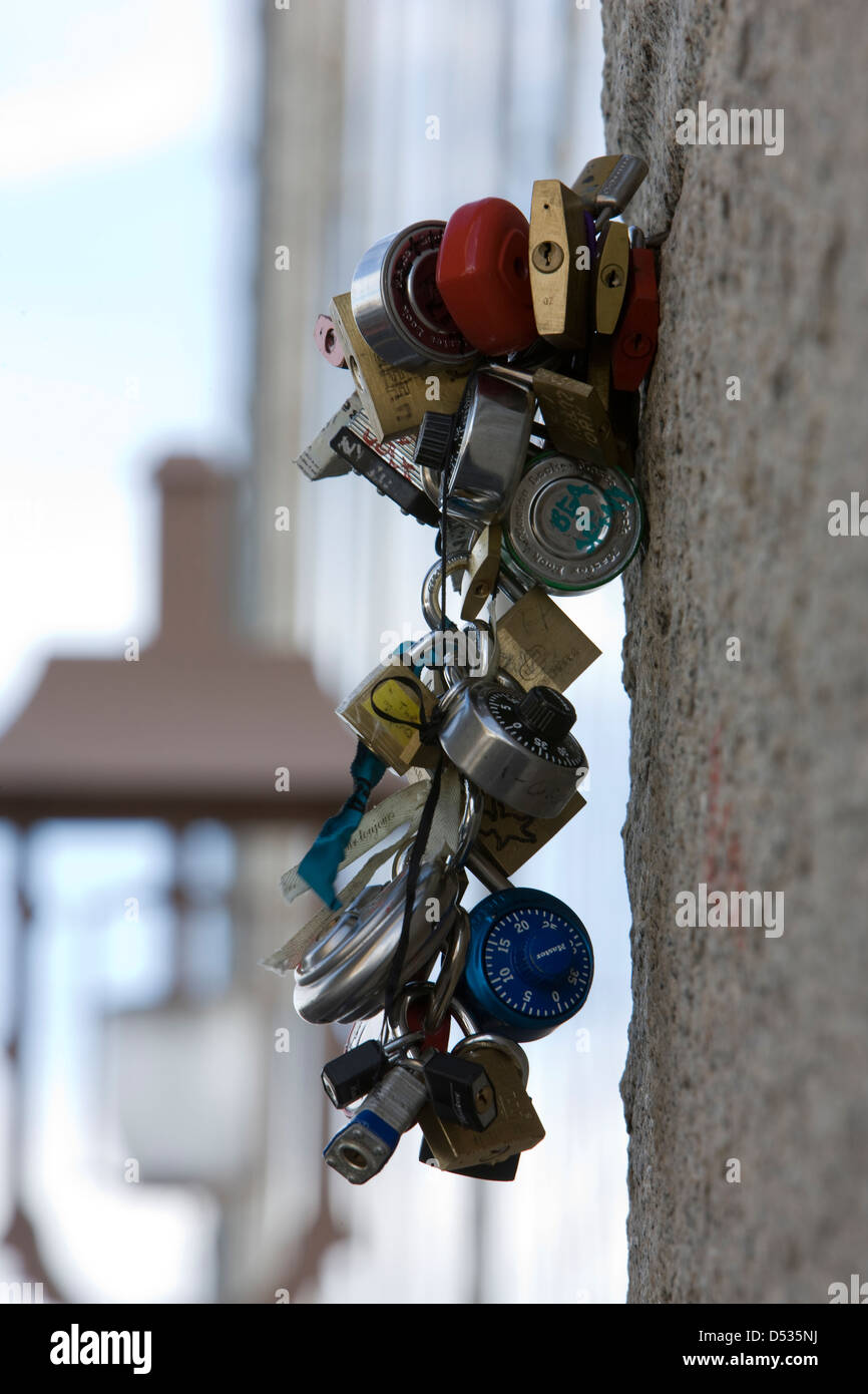 Clusters of padlocks attached to the piers of the Brooklyn Bridge as ...
