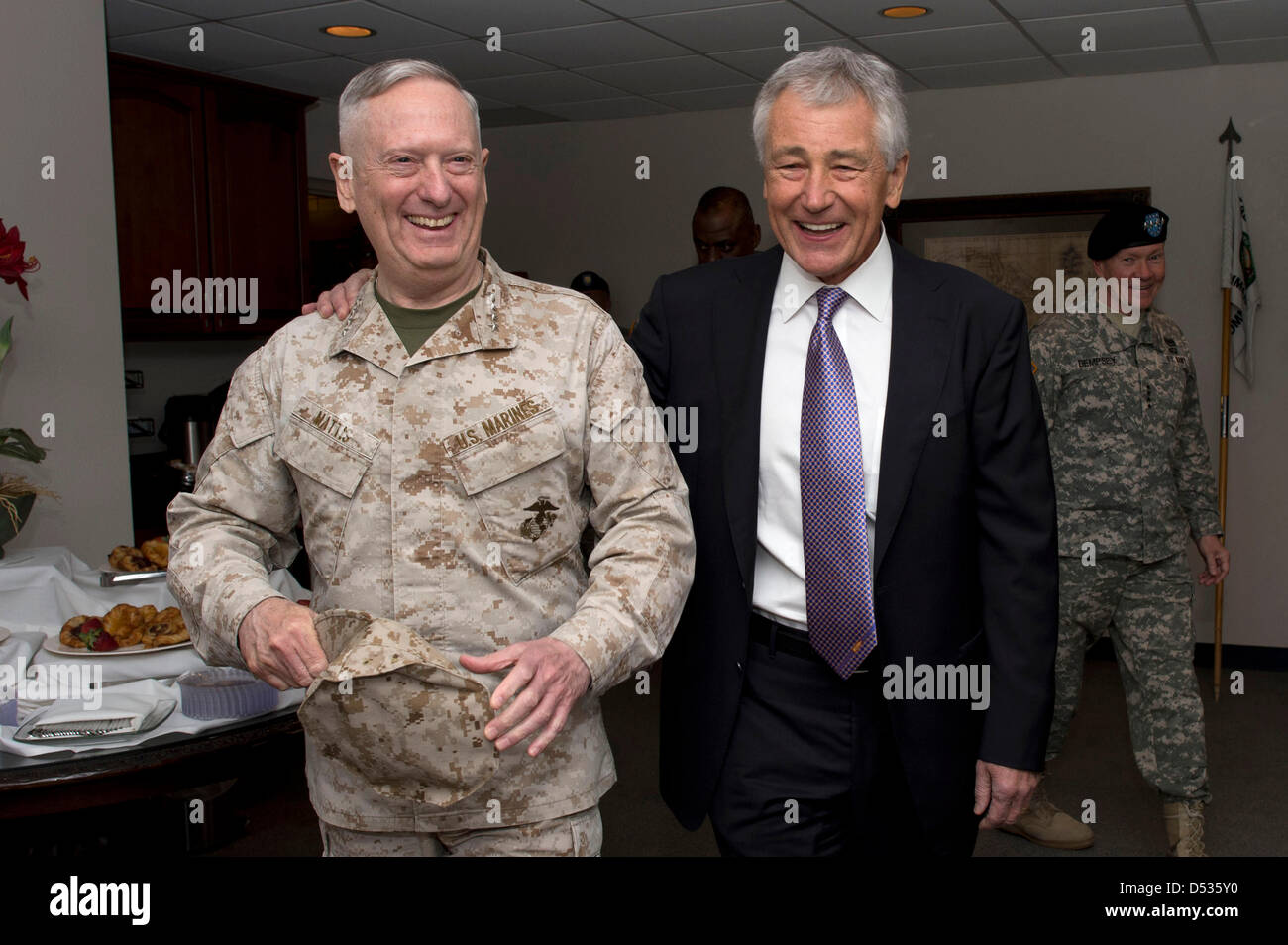 US Secretary of Defense Chuck Hagel laughs with General James Mattis ...