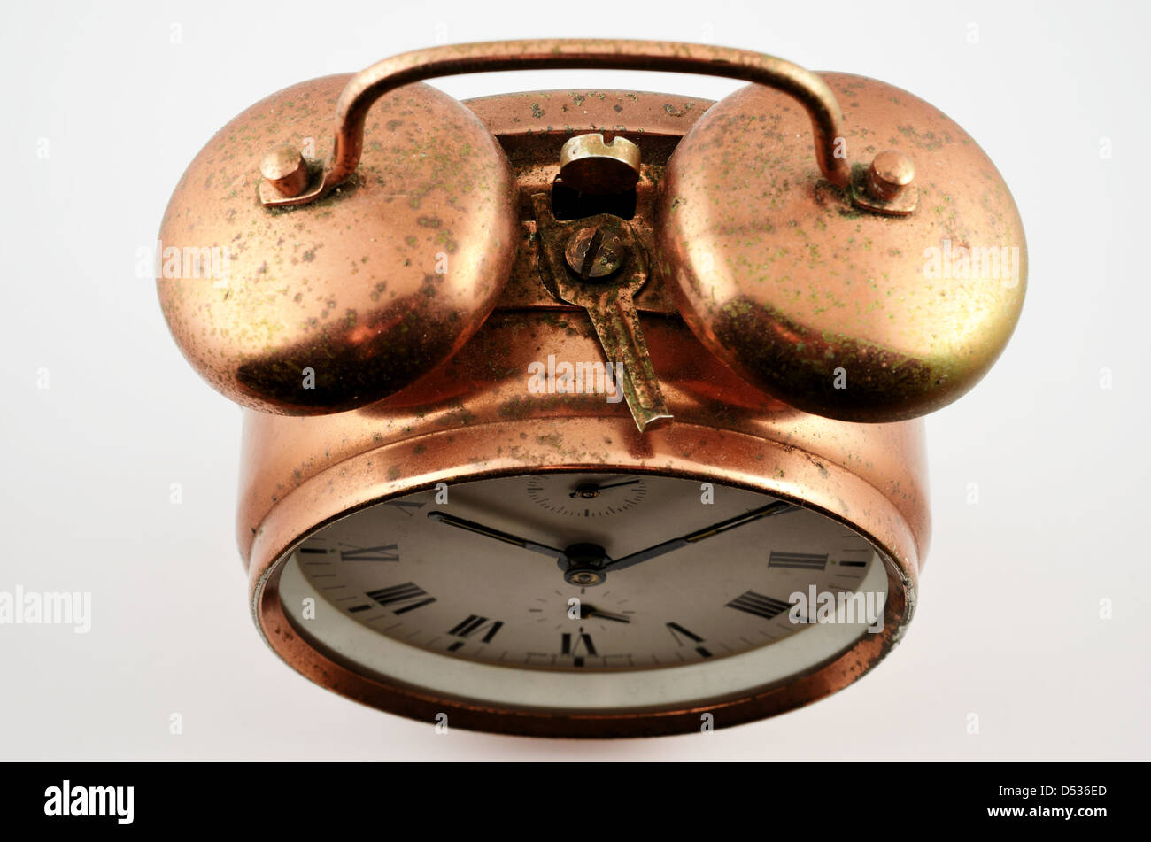 old-fashioned vintage copper alarm clock over white Stock Photo - Alamy
