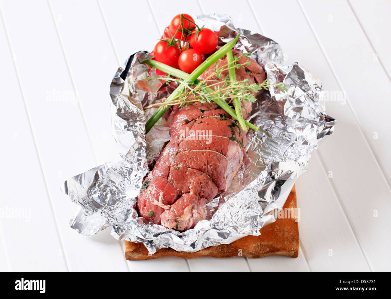 Herbed beef tenderloin in tinfoil Stock Photo - Alamy