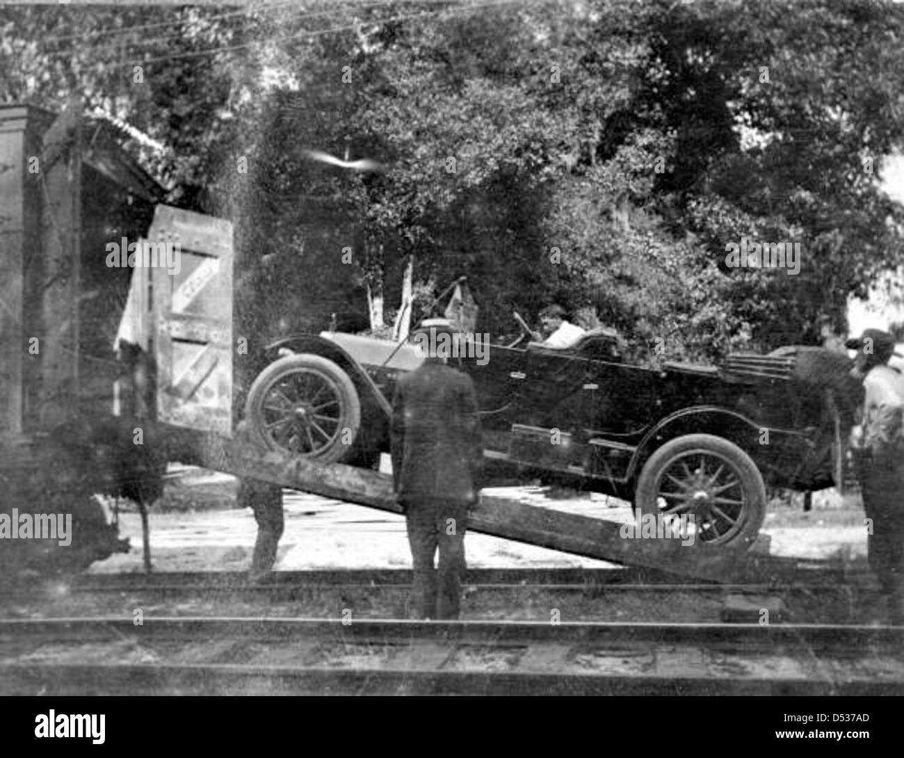 This image shows a car being loaded onto a train at De Leon Springs ...