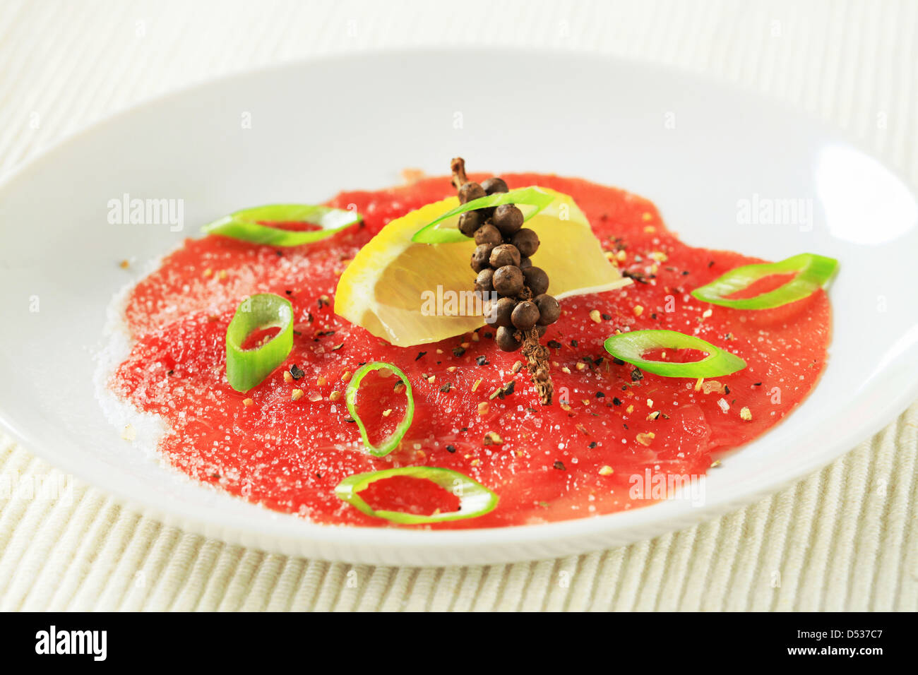 Beef Carpaccio with lemon and spring onion Stock Photo - Alamy