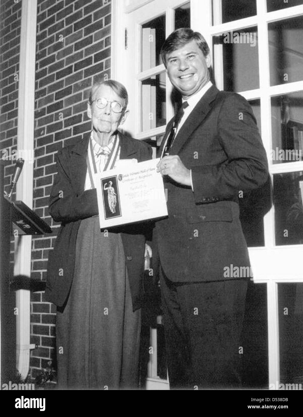 Governor Bob Graham presents a certificate to Dorothy Dodd, honoring ...