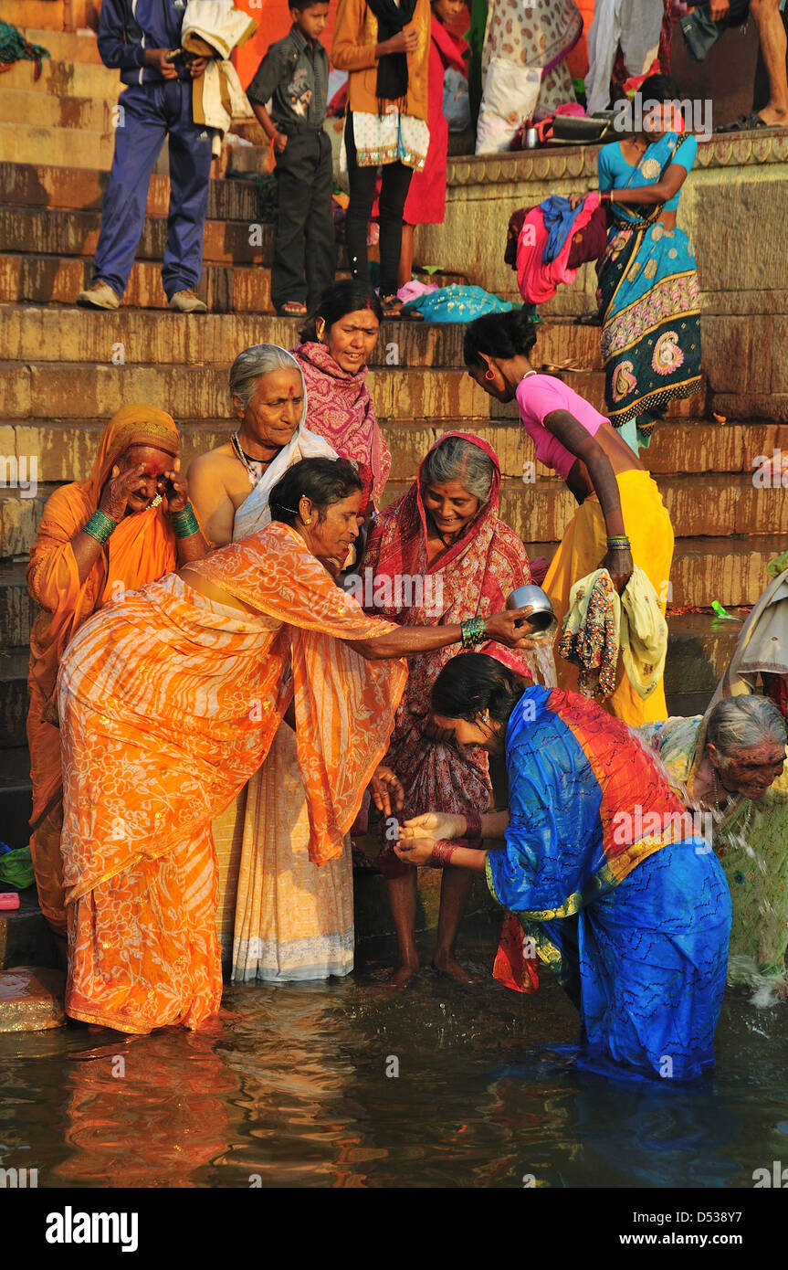 Pilgrims bathing in the Ganges river in Varanasi Stock Photo - Alamy