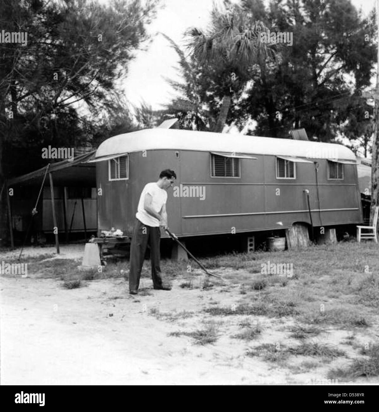 Al Stickles is pictured tending to his yard near his trailer in ...