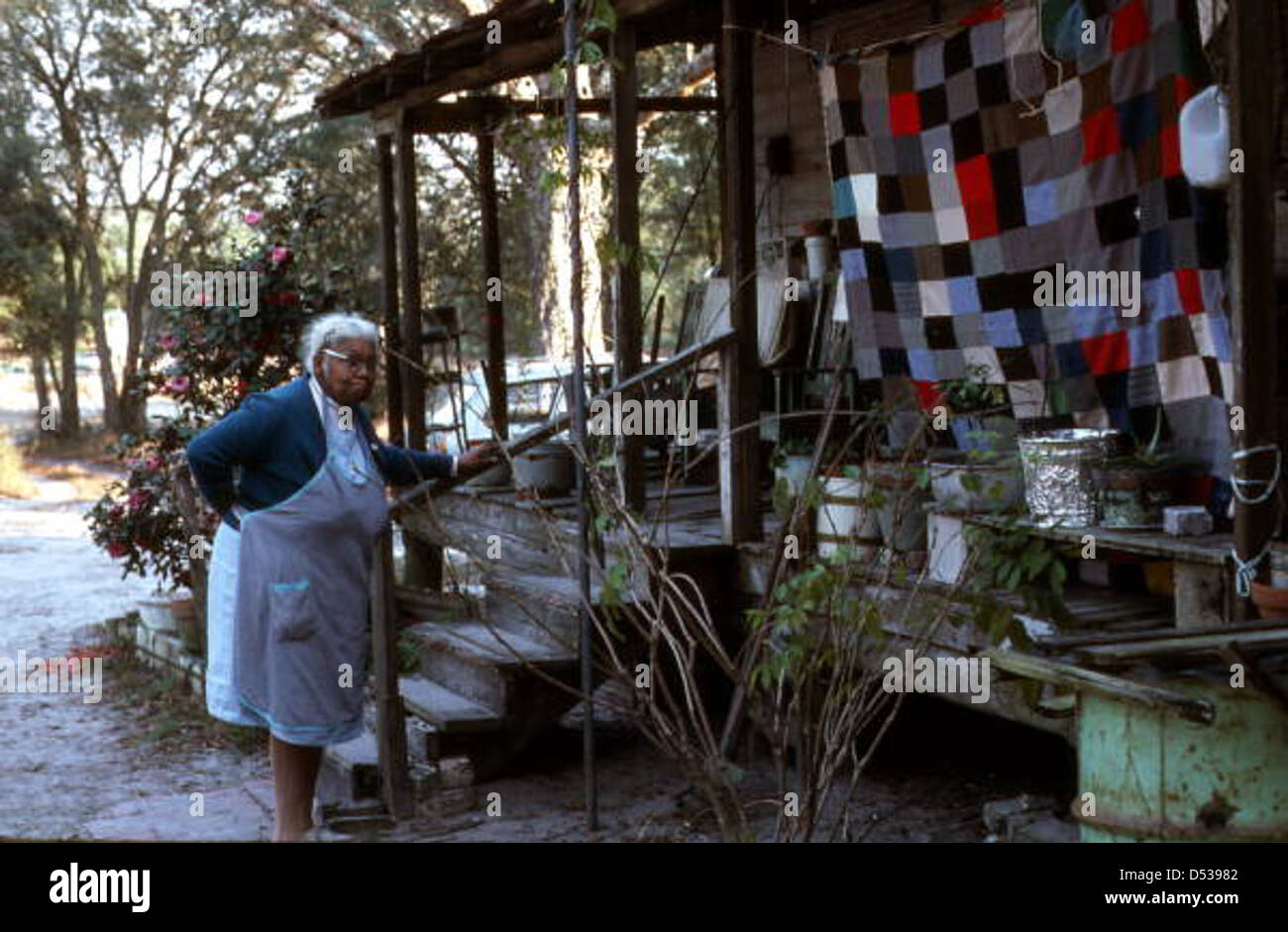 Ruth Rowe, a quiltmaker from Pomona Park, Florida, works on a quilt at ...