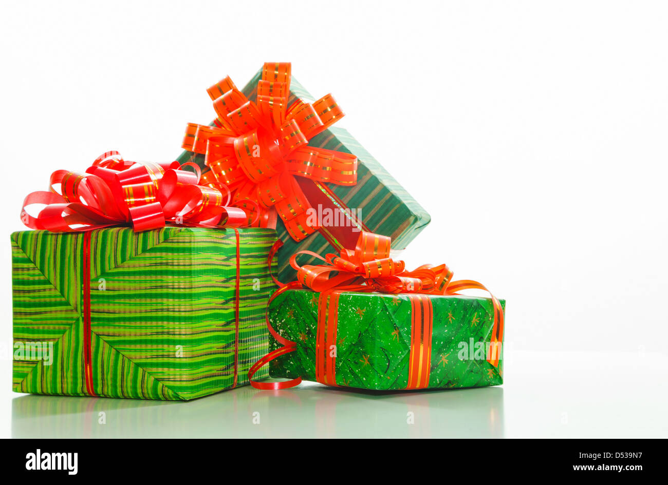 Green boxes with presents against white background Stock Photo - Alamy