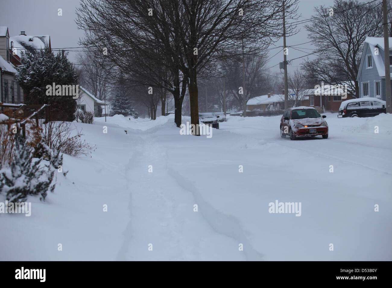 Man with snow blower after a heavy snowstorm in Kitchener, Ontario ...