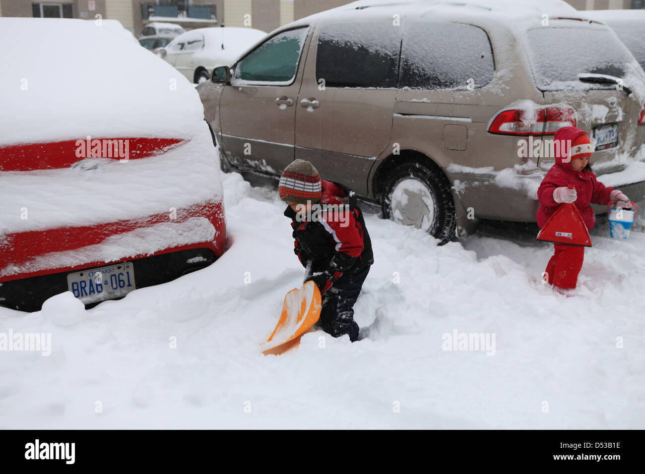 Kids playing in snow in Ontario, Canada Stock Photo - Alamy