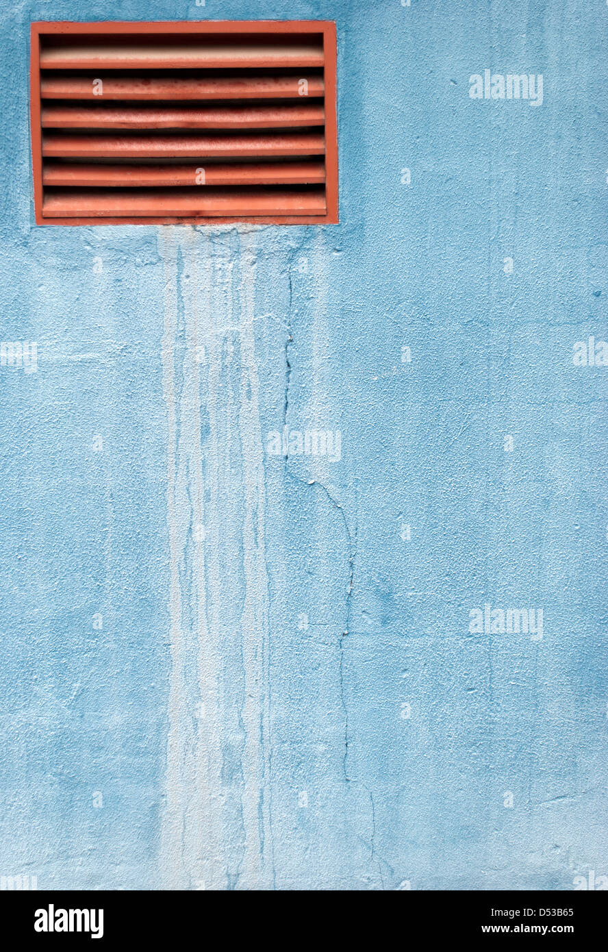 Blue wall with a ventilation window Stock Photo - Alamy