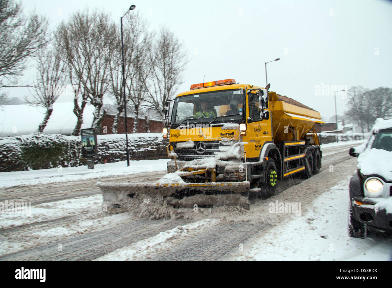 Sheffield, UK. 23rd March 2013. Snow plow at work clearing snow form ...
