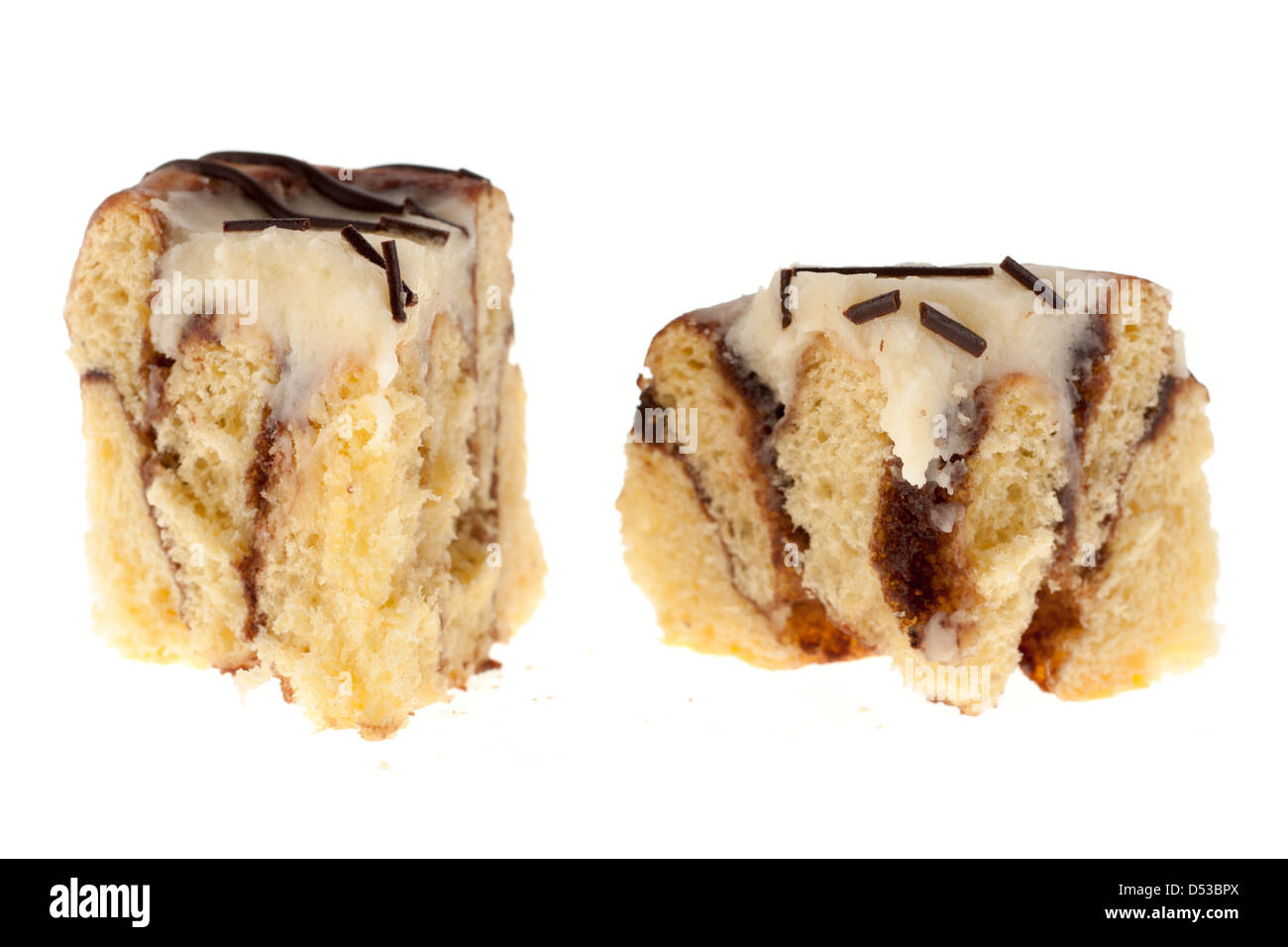 Two pieces of chocolate veined iced sponge Stock Photo - Alamy