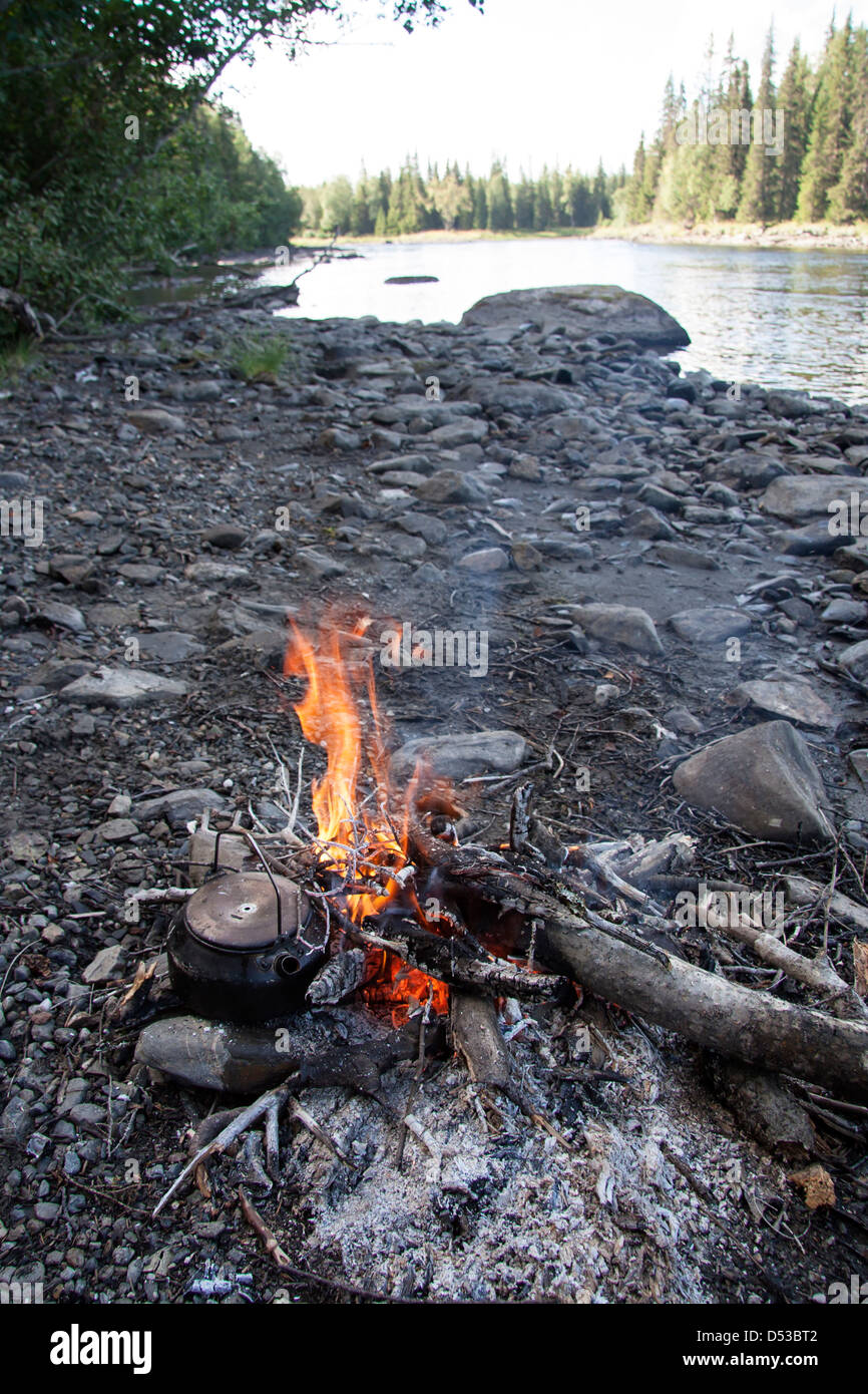 Camp fire in wild mountain Stock Photo - Alamy