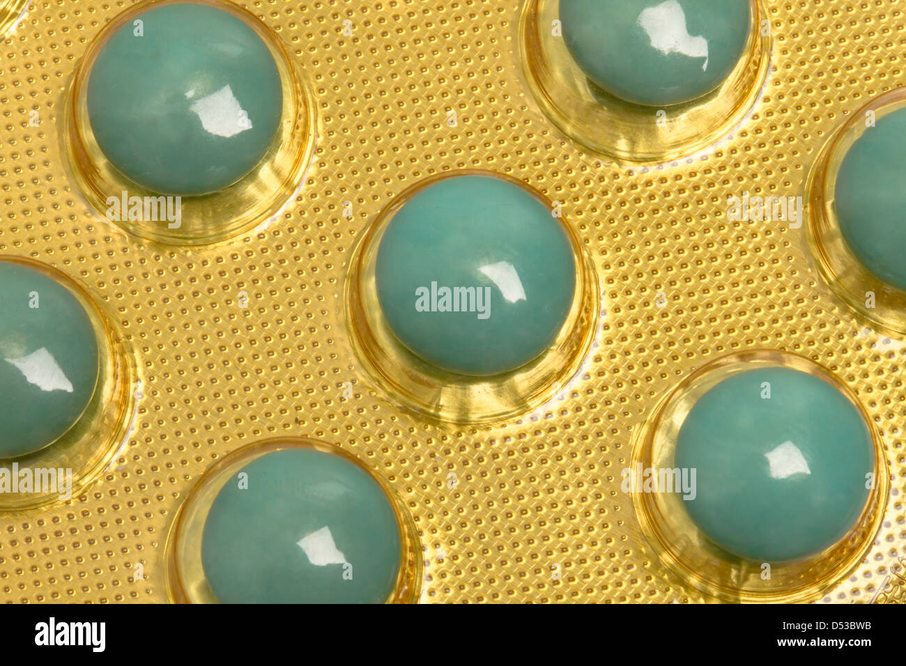 Green pills isolated on white background Stock Photo - Alamy