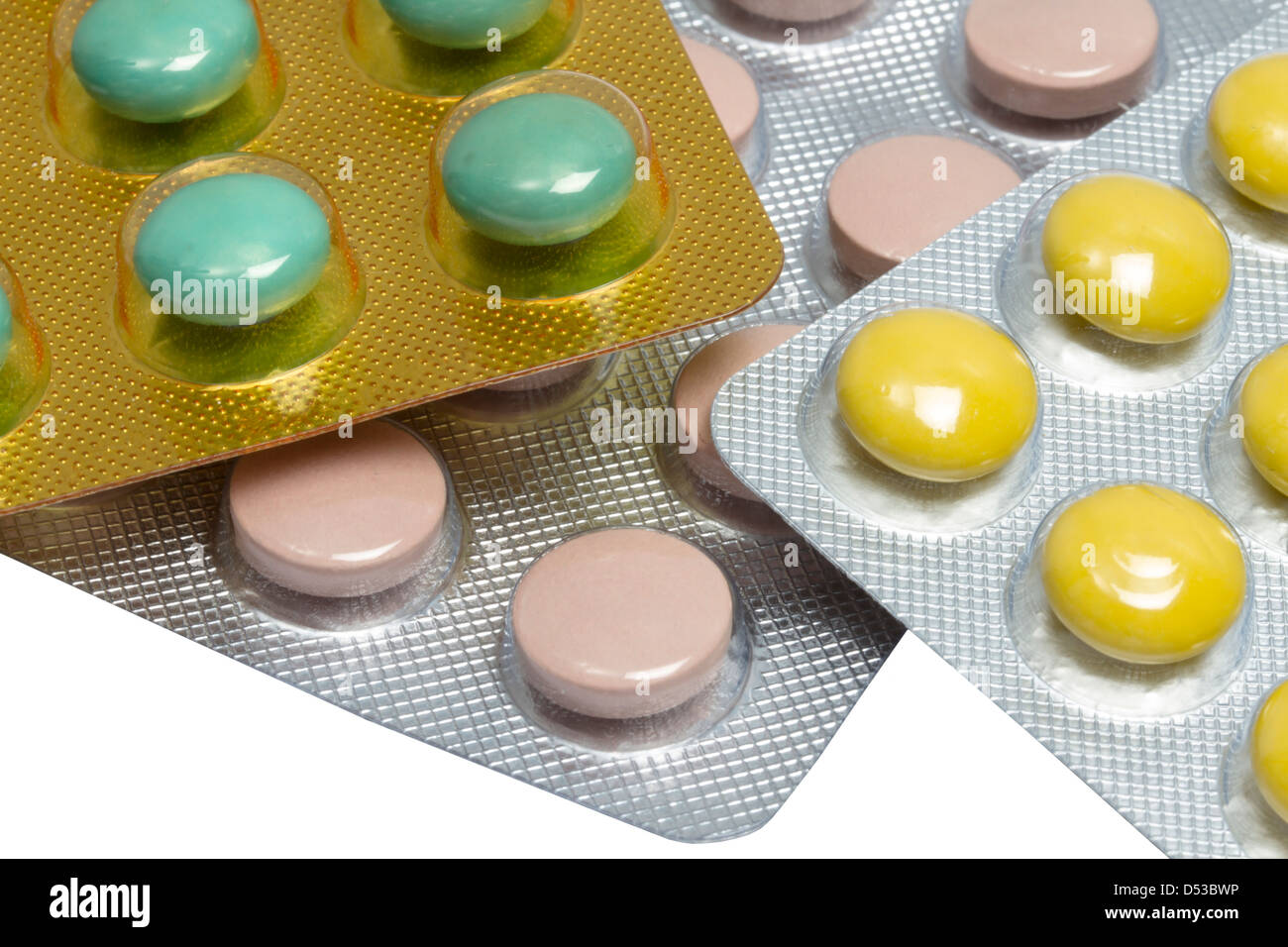 Colorful pills closeup on white background Stock Photo - Alamy