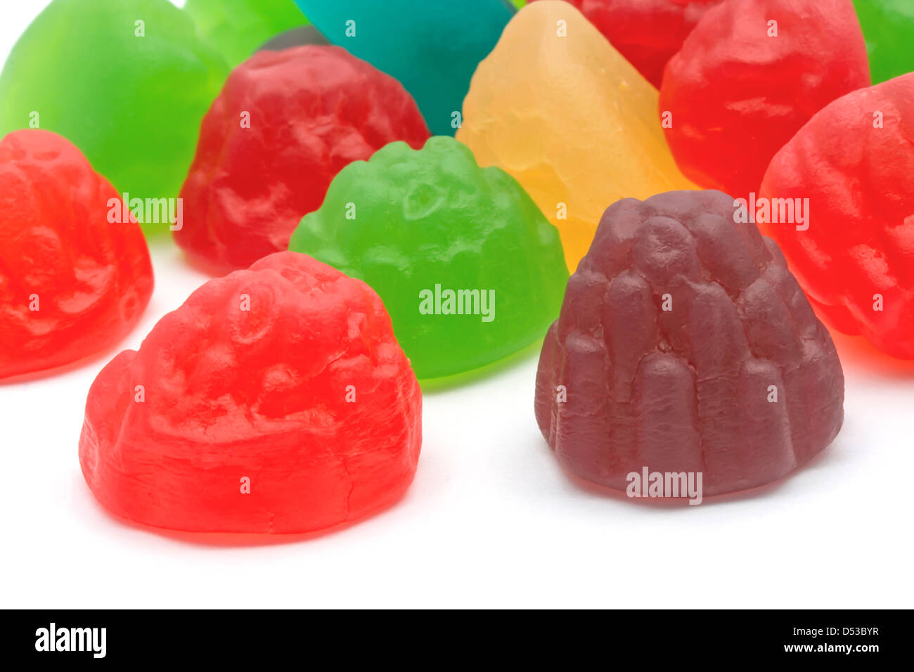 Colorful fruits candy closeup on white background Stock Photo - Alamy