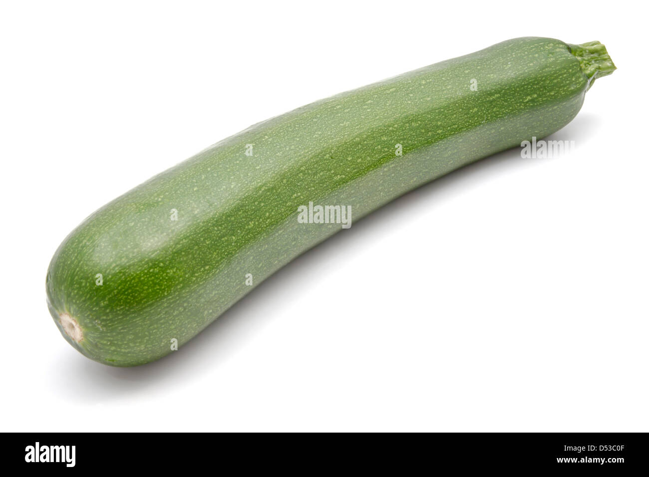 green zucchini closeup on white background Stock Photo - Alamy