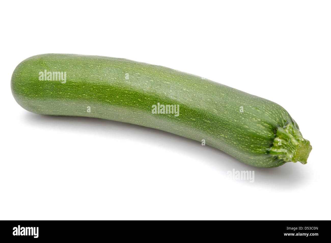 green zucchini closeup on white background Stock Photo - Alamy