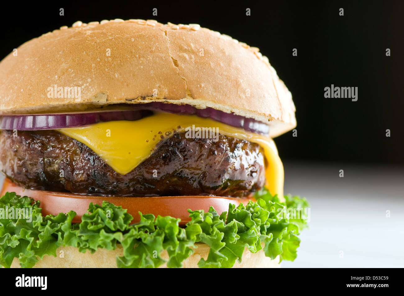 appetizing cheeseburger with red onion closeup Stock Photo - Alamy
