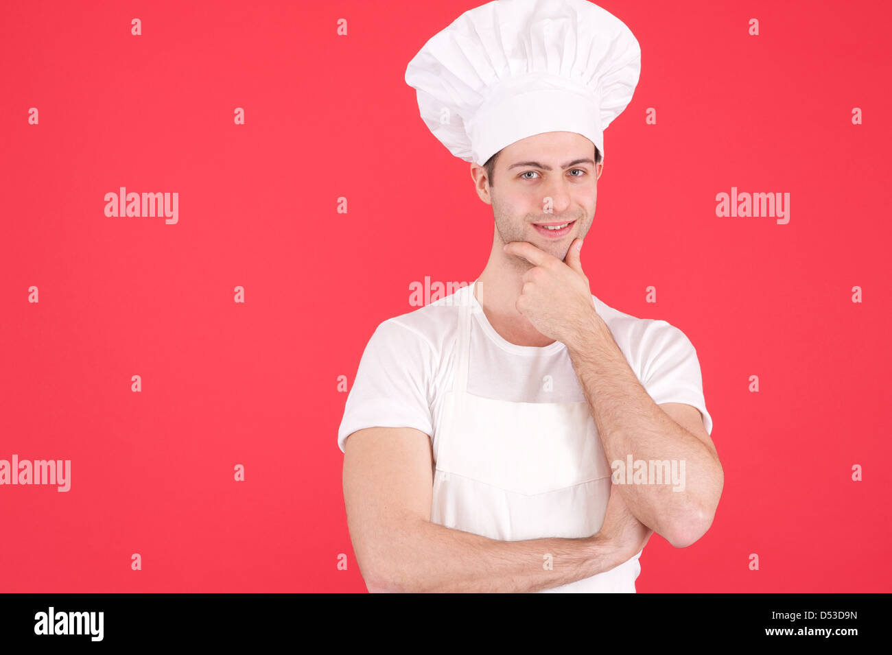 chef shot in red background Stock Photo - Alamy