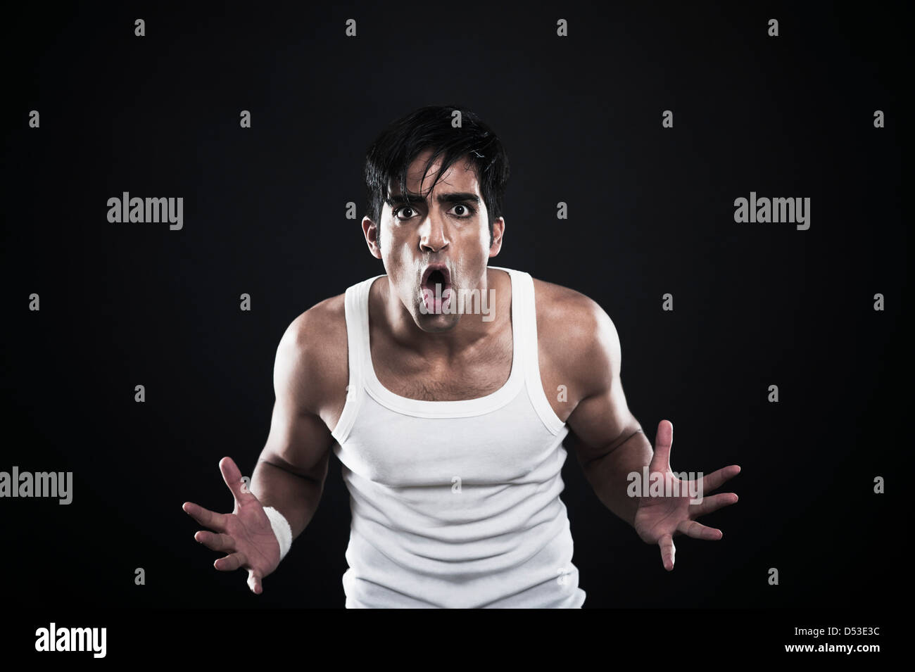 Portrait of a man shouting and looking shocked Stock Photo - Alamy