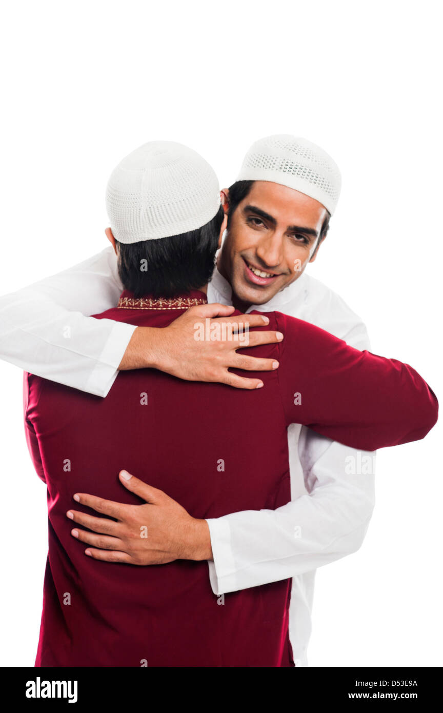 Friends embracing each other during Eid festival Stock Photo - Alamy