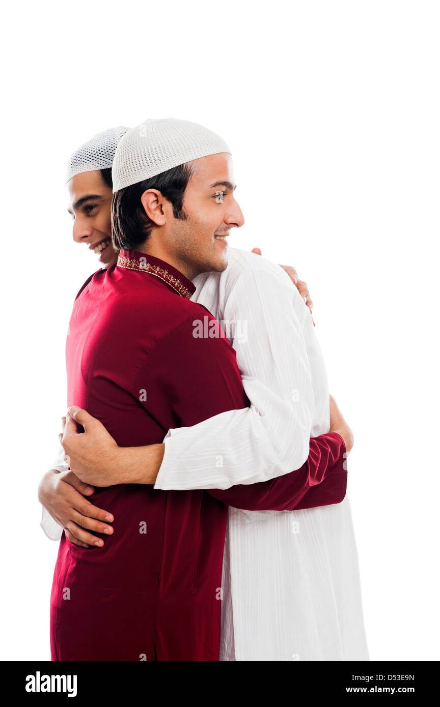 Friends embracing each other during Eid festival Stock Photo - Alamy