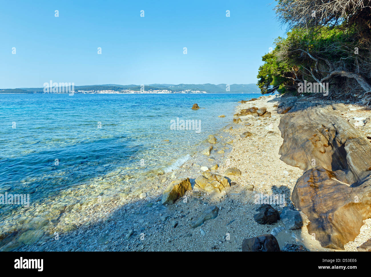 Summer stony beach and clean water surface of Adriatic Sea (Croatia ...