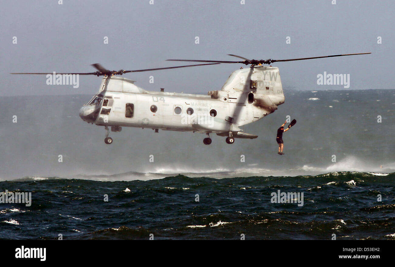 A US Marine assigned to the Force Reconnaissance Platoon jumps from a ...