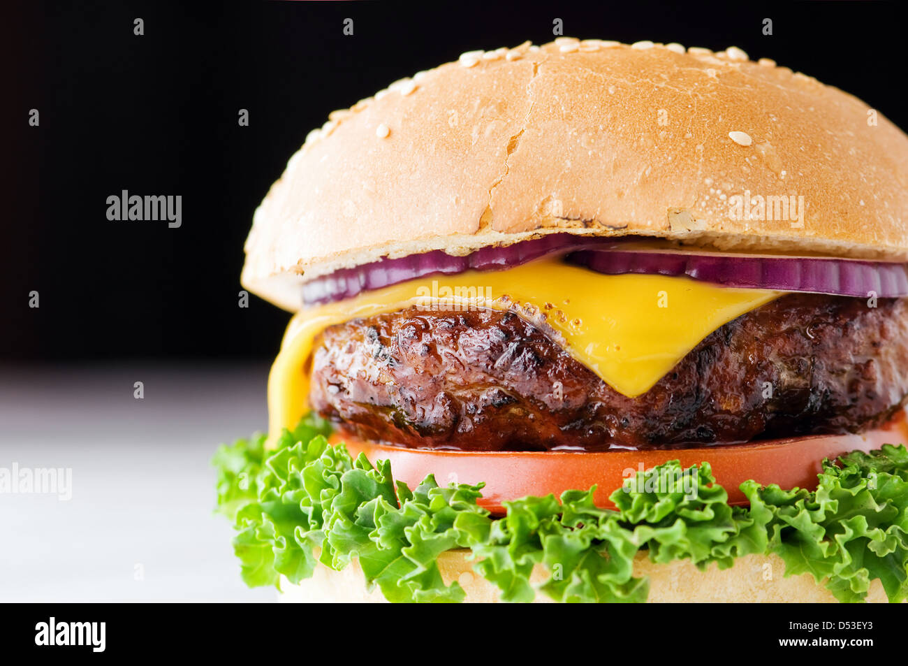 appetizing cheeseburger with red onion closeup Stock Photo - Alamy