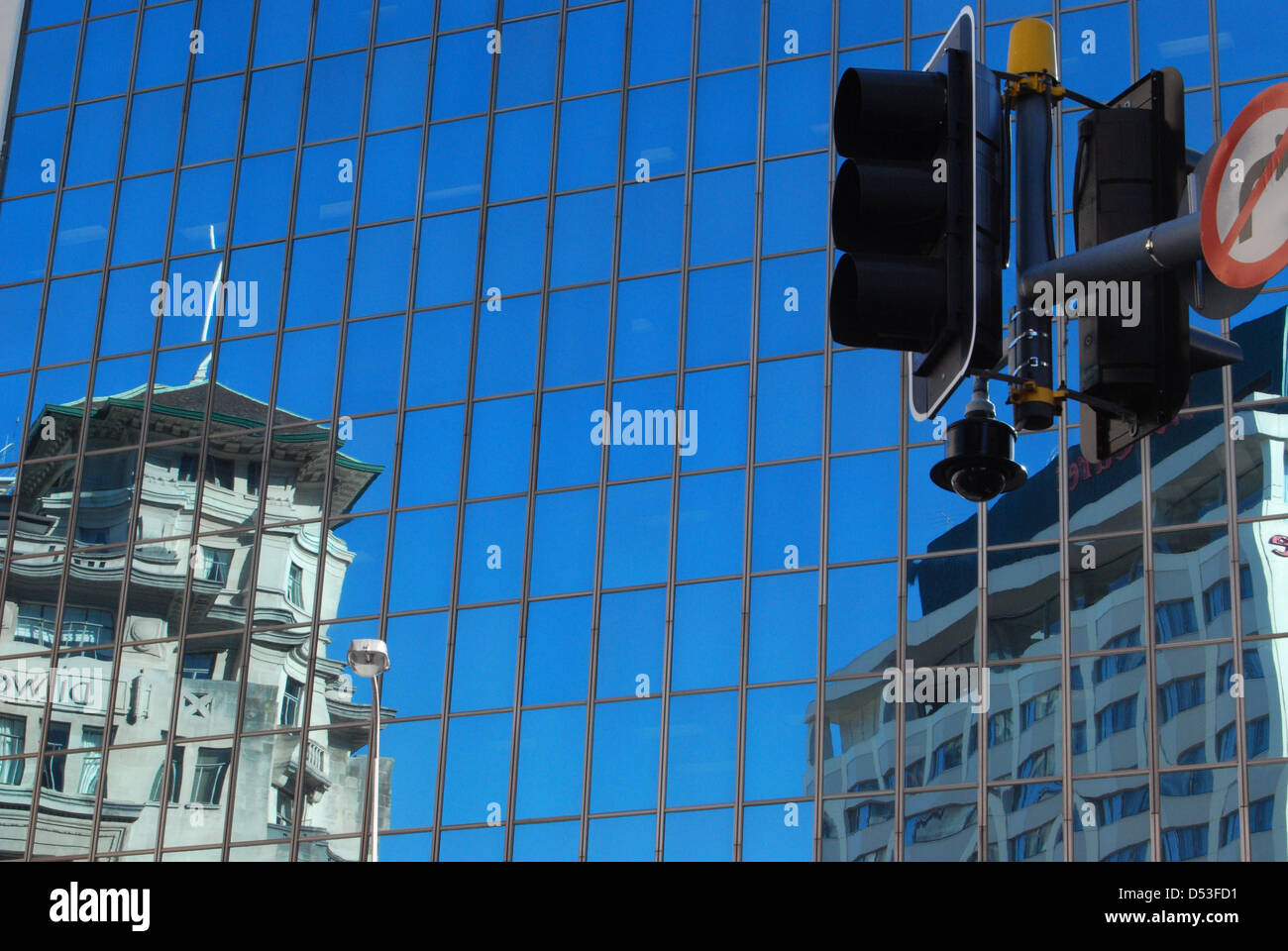 Auckland street view reflected in a building Stock Photo - Alamy