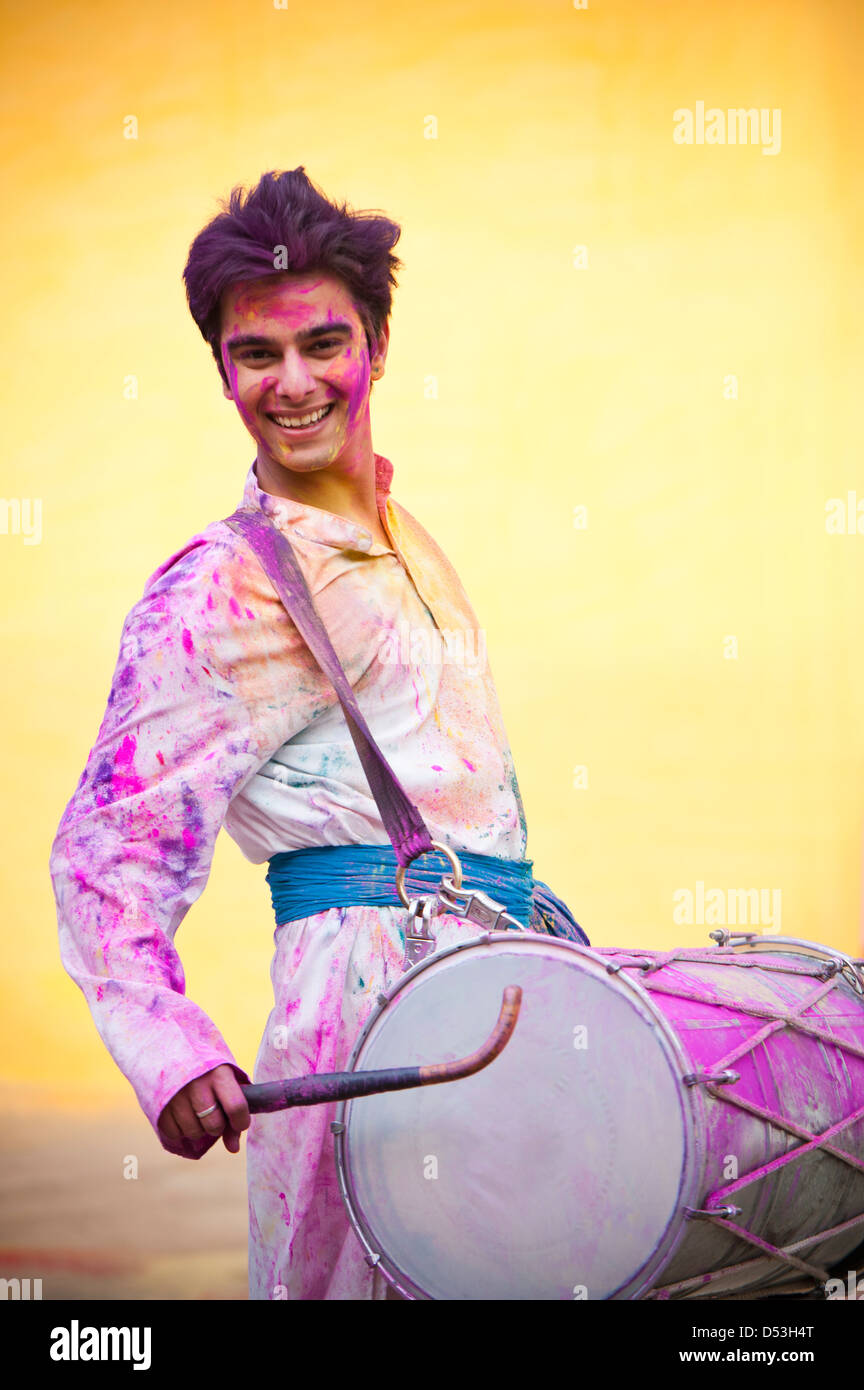 Portrait of a man celebrating Holi with playing dhol Stock Photo - Alamy