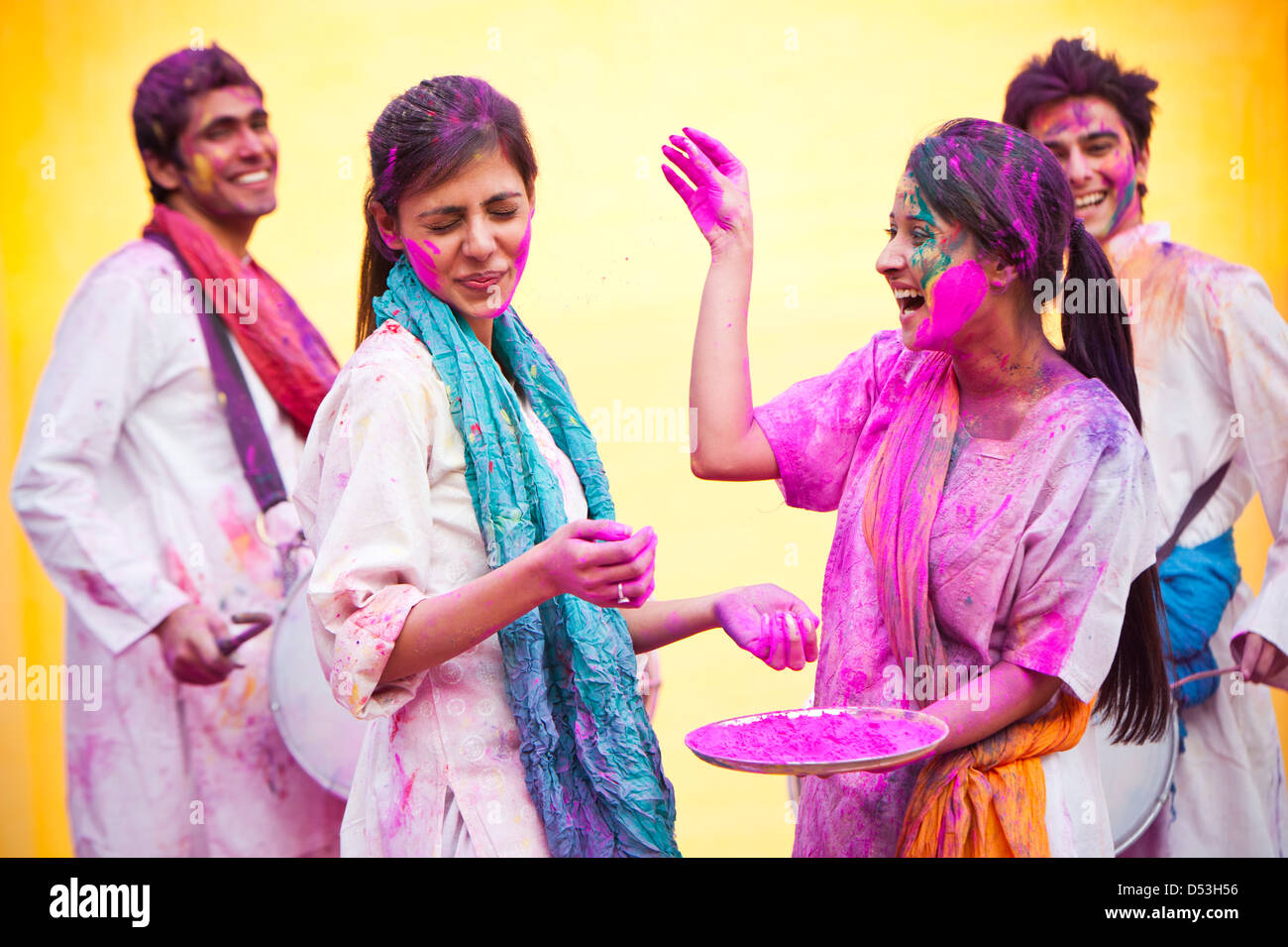 Friends celebrating Holi Stock Photo - Alamy