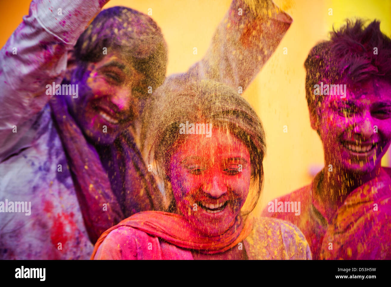 Friends celebrating Holi Stock Photo - Alamy