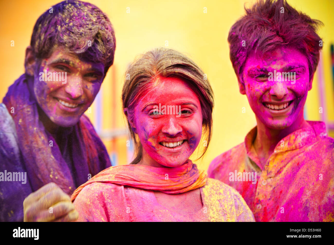 Portrait three friends playing holi hi-res stock photography and images ...