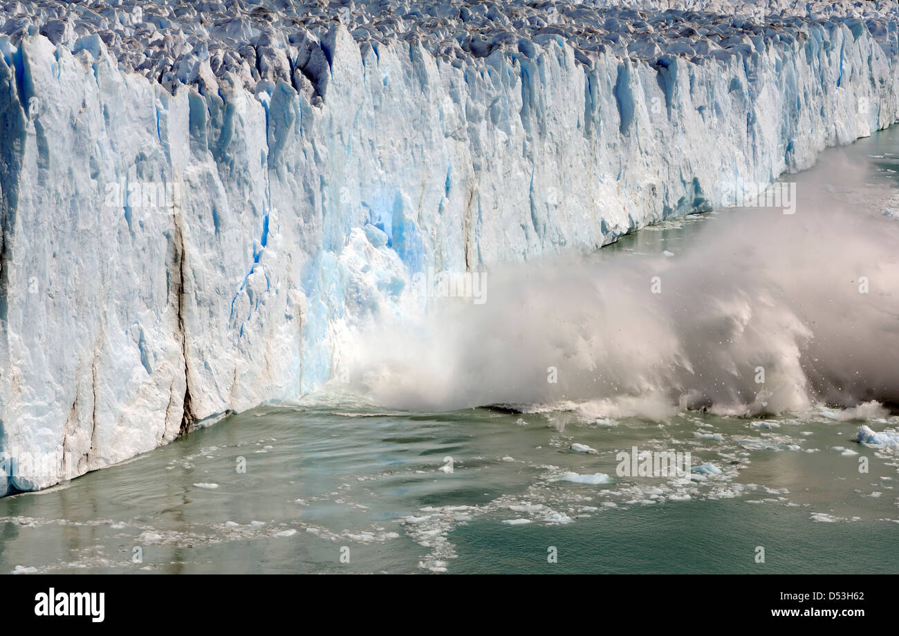 A tower of ice collapses from the face of the Perito Moreno Glacier ...