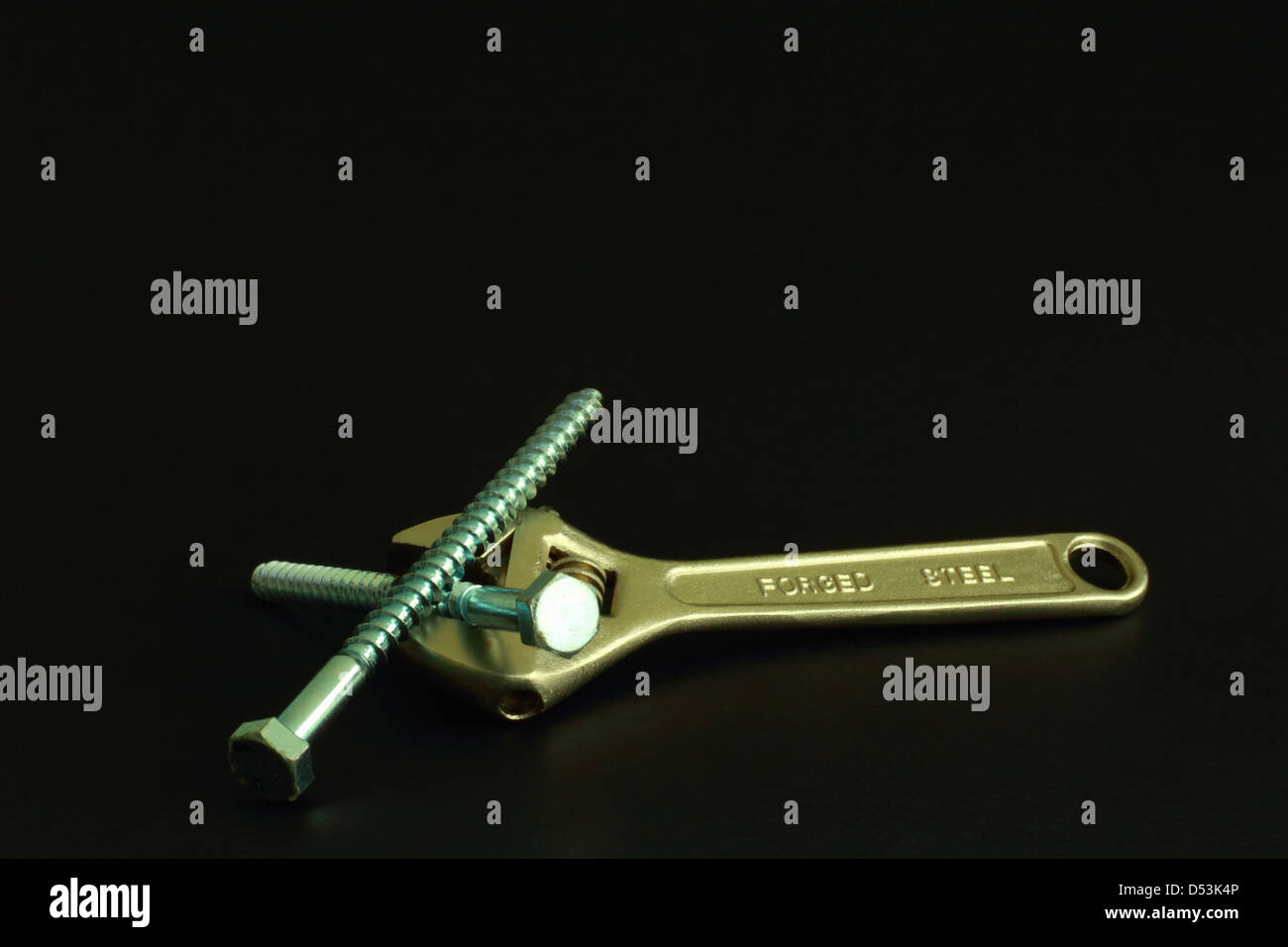 Spanner with screws Stock Photo - Alamy