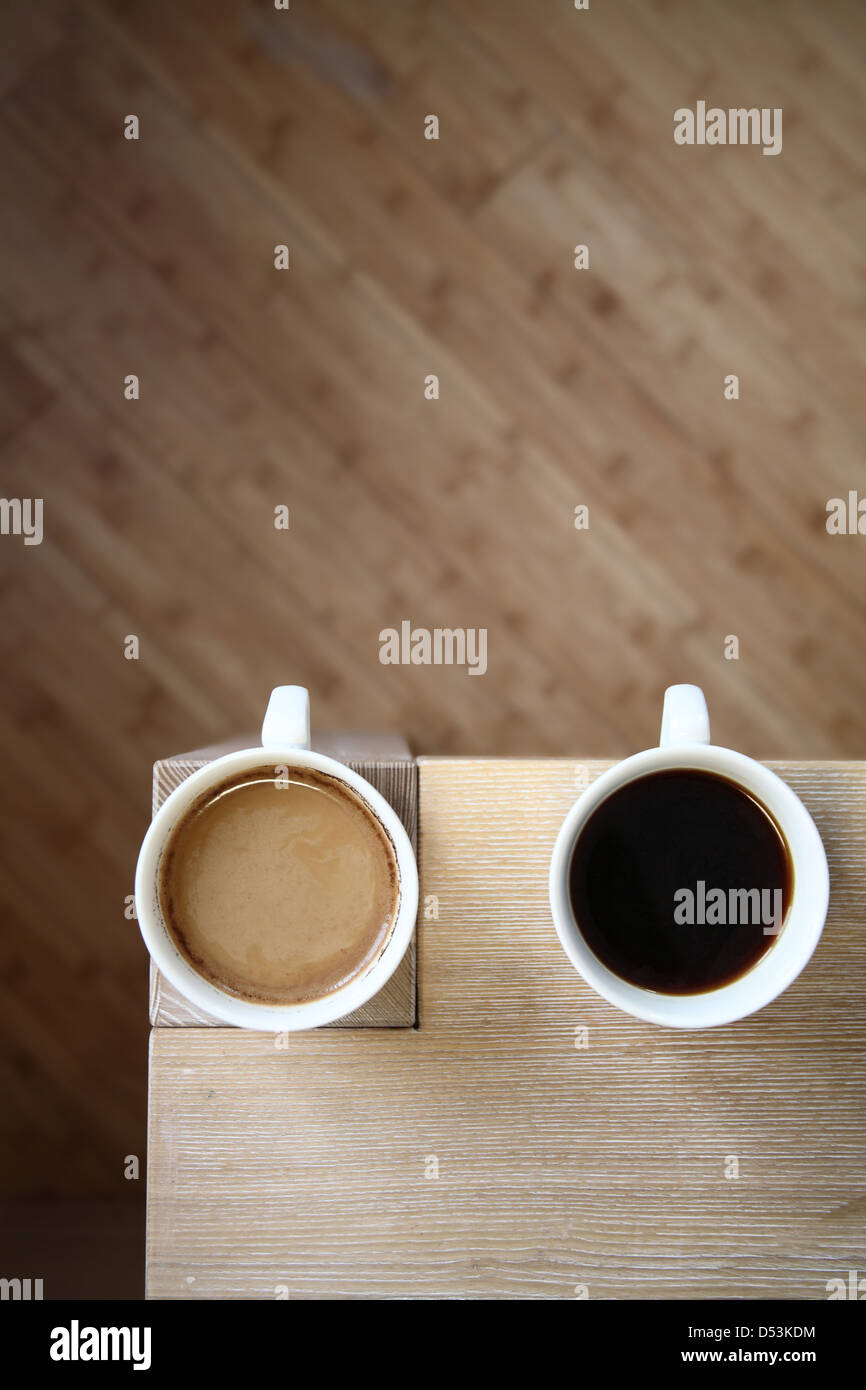 Two cups of coffee: black and cappuccino Stock Photo - Alamy