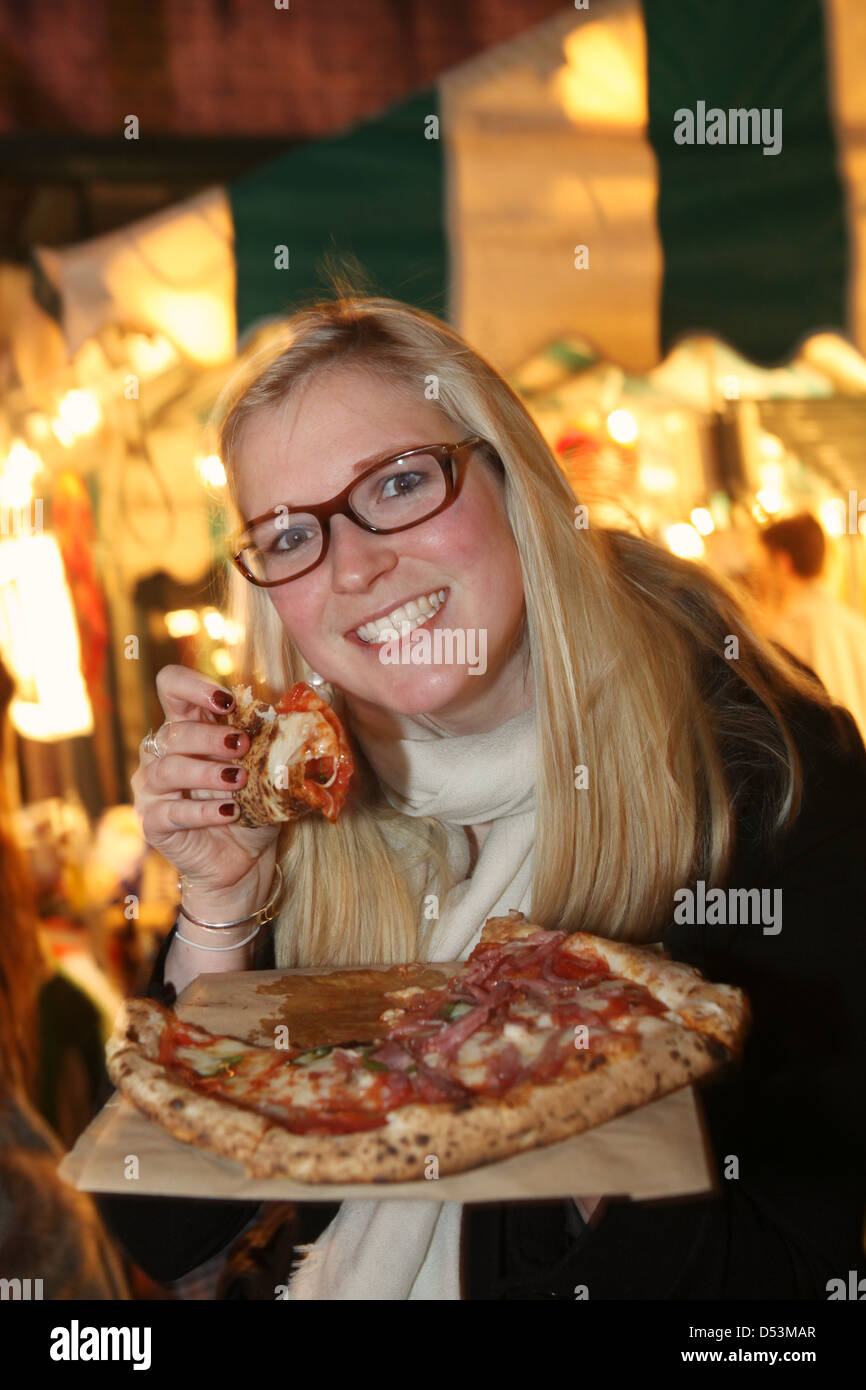 people eating food at Feast food festival at Tobacco Dock, London UK ...
