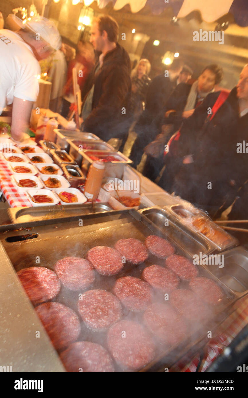 people eating food at Feast food festival at Tobacco Dock, London UK ...