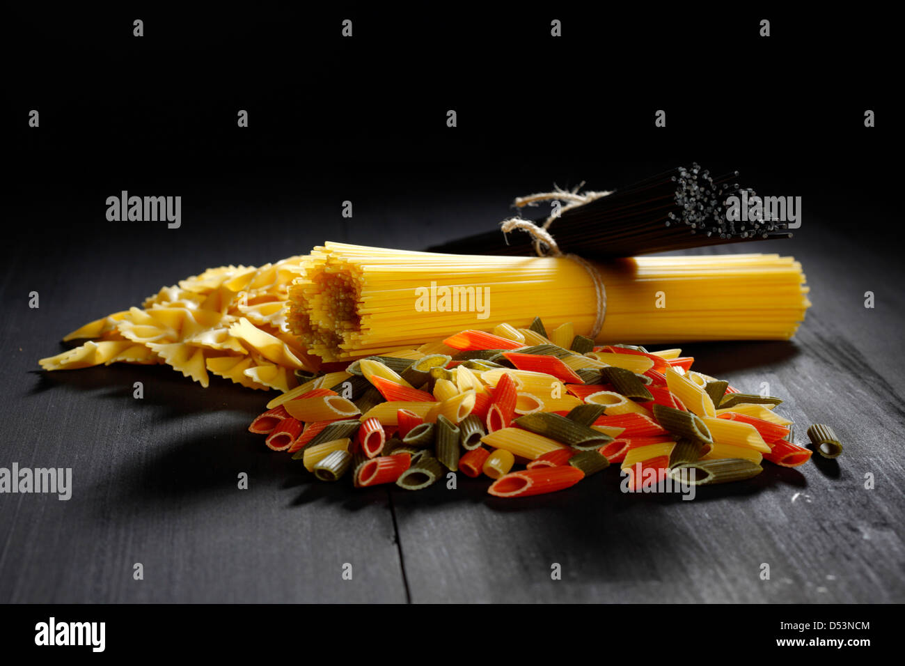 Variety of types and shapes of Italian pasta on black table Stock Photo ...