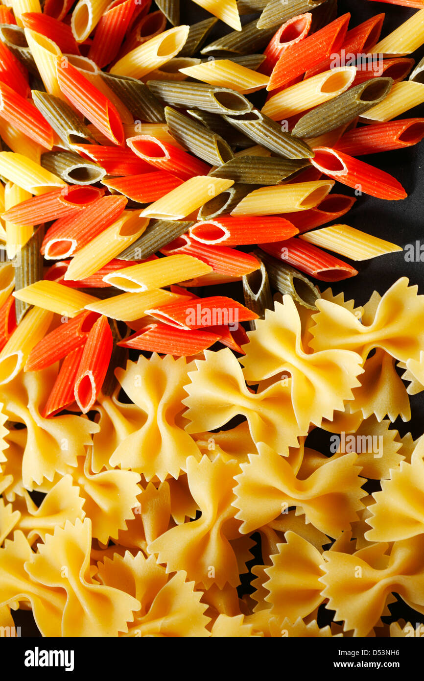 Variety of types and shapes of Italian pasta on black table Stock Photo ...