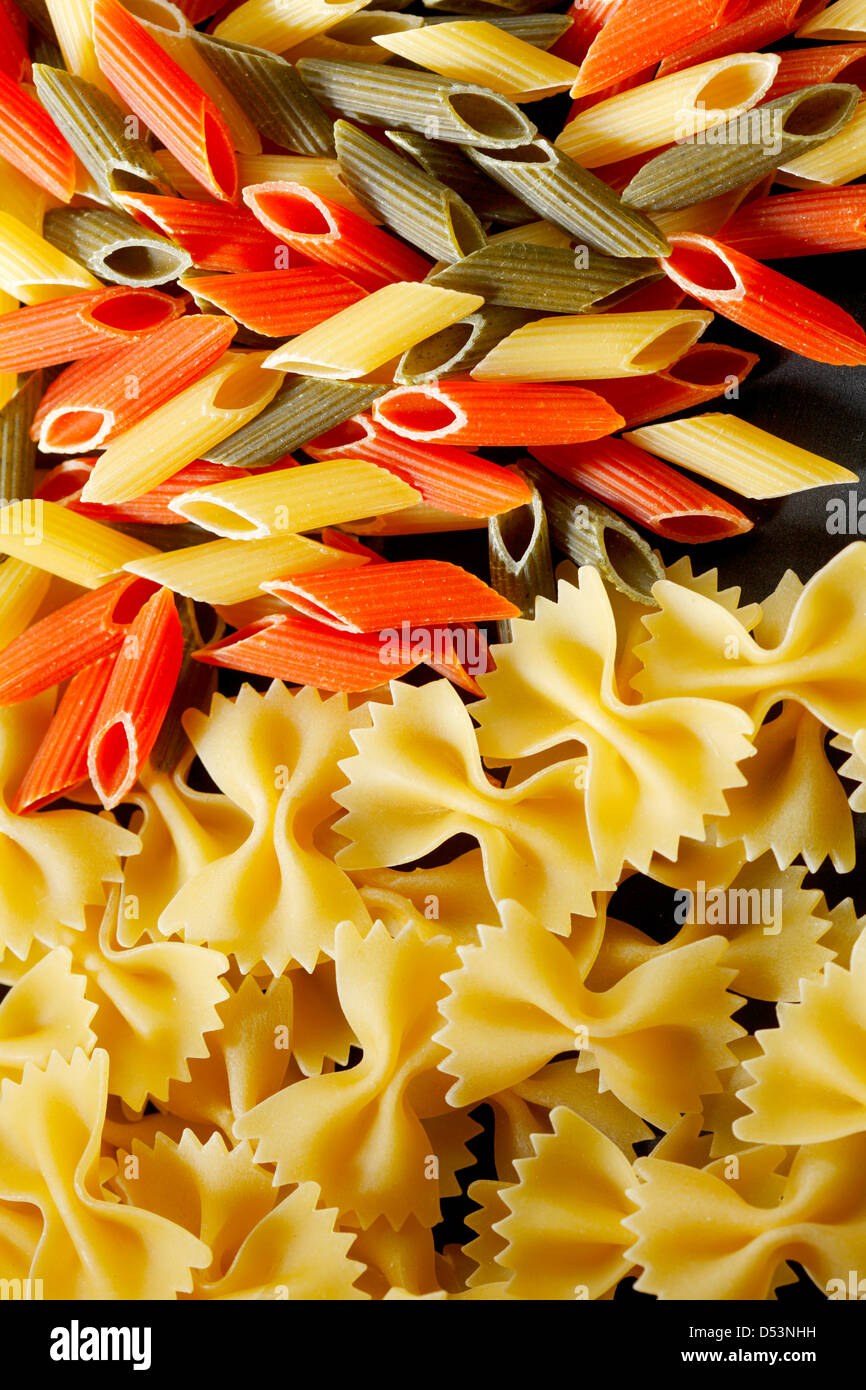 Variety of types and shapes of Italian pasta on black table Stock Photo ...