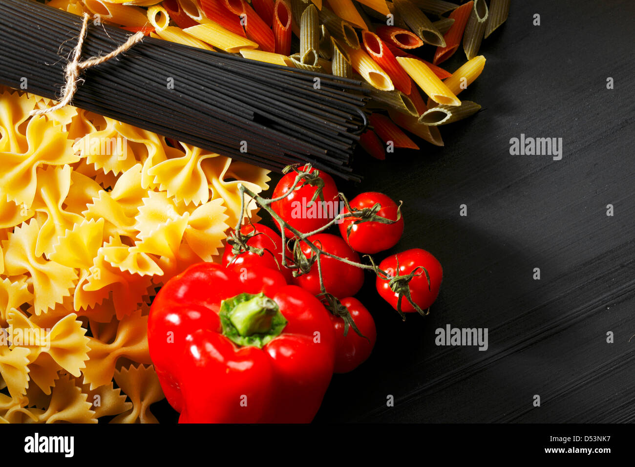 Pasta ingredients on black table, italian cuisine concept Stock Photo ...