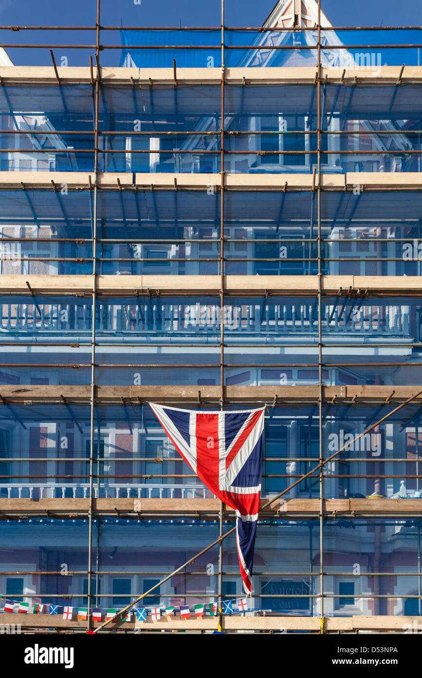 Large period building undergoing renovation with extensive scaffolding ...