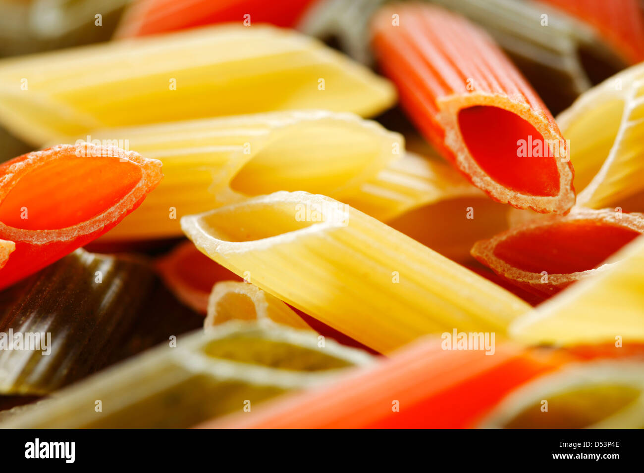 Colored dry italian pasta background Stock Photo - Alamy